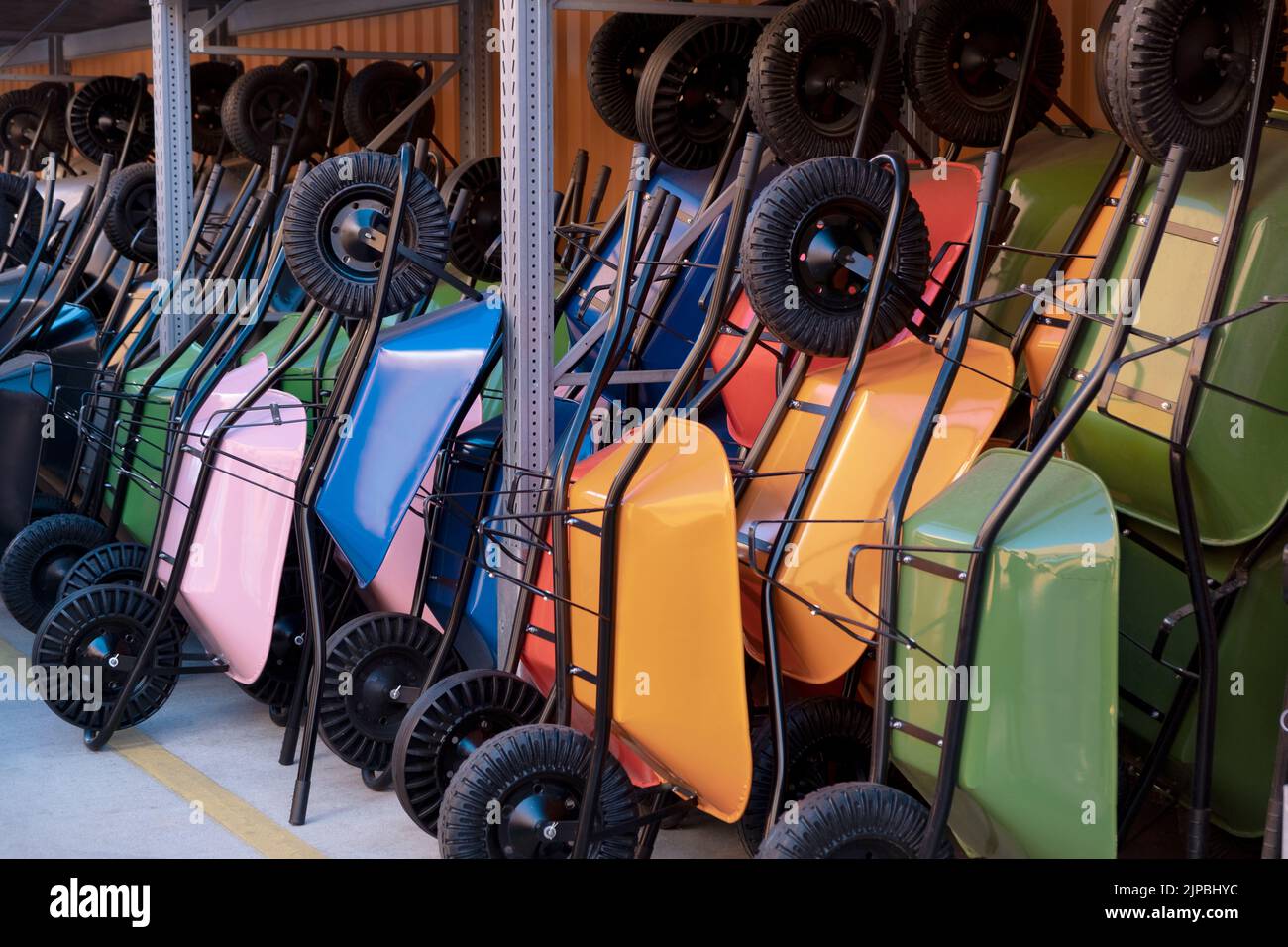 A lot of New various color Garden wheelbarrow cart on hardware store ...