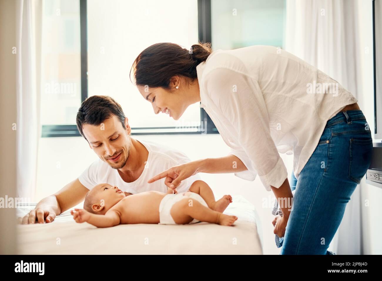 The new bundle of joy, a brand new baby boy. a happy mother and father ...