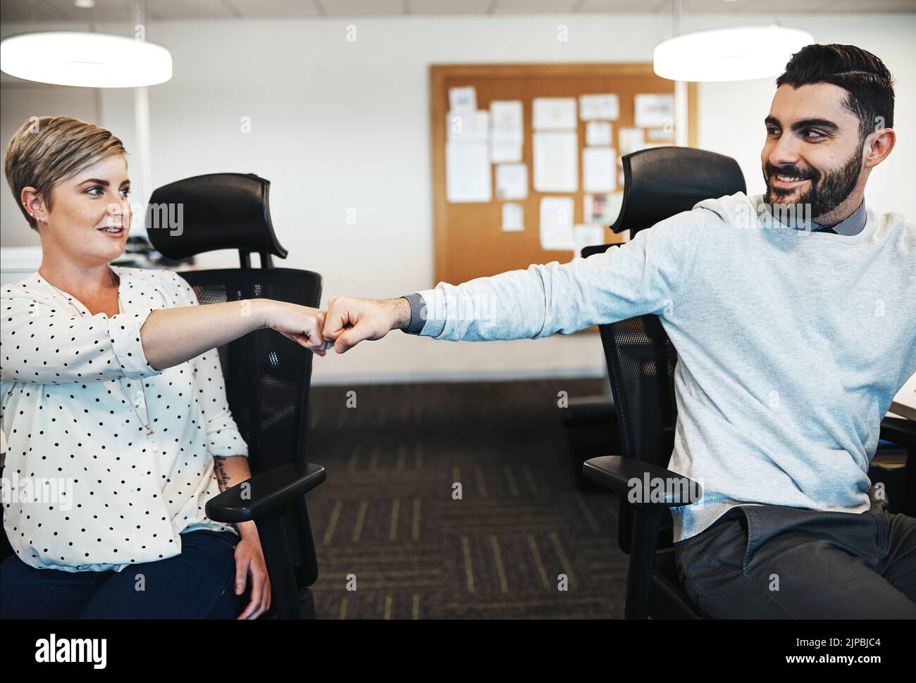 Yes we figured it out together. creative colleagues giving each other a ...