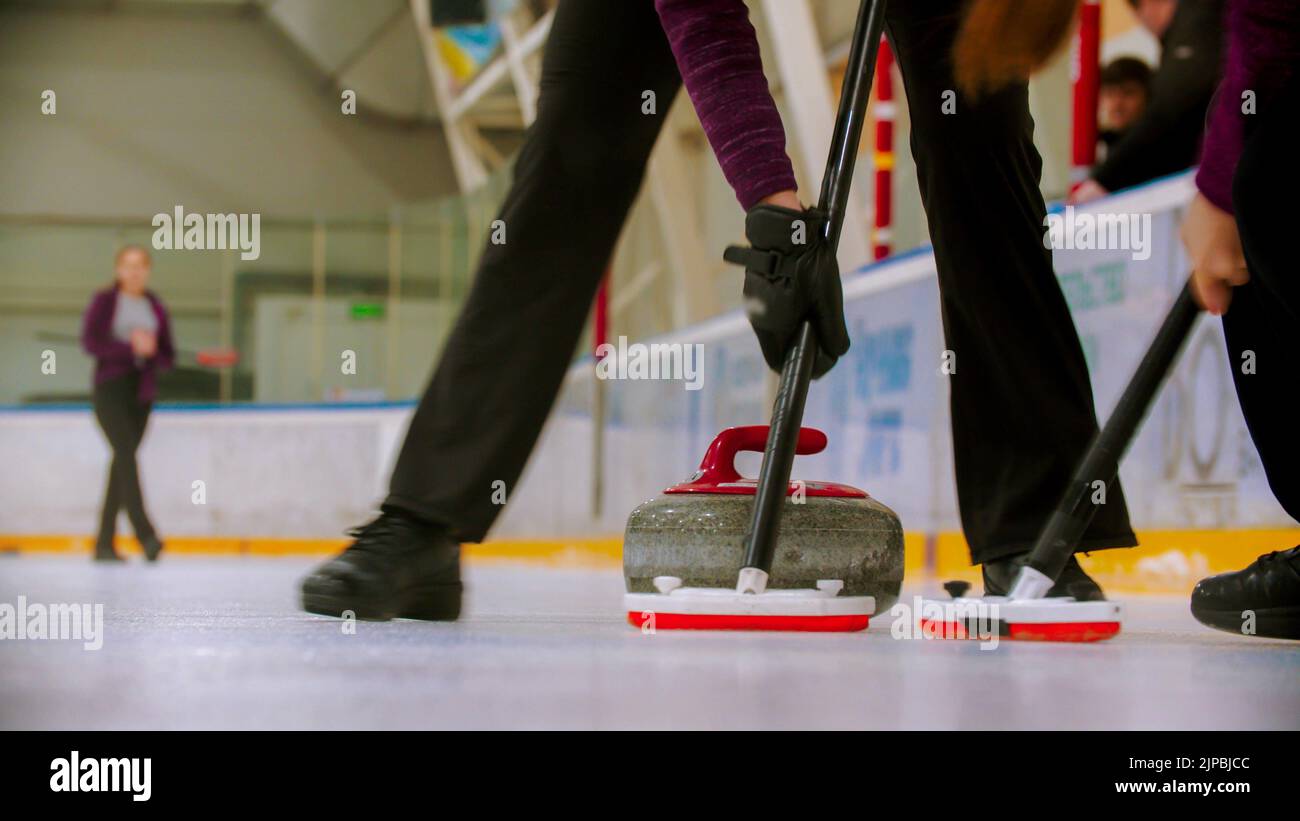Curling training - leading granite stone on the ice - clearing the ice ...