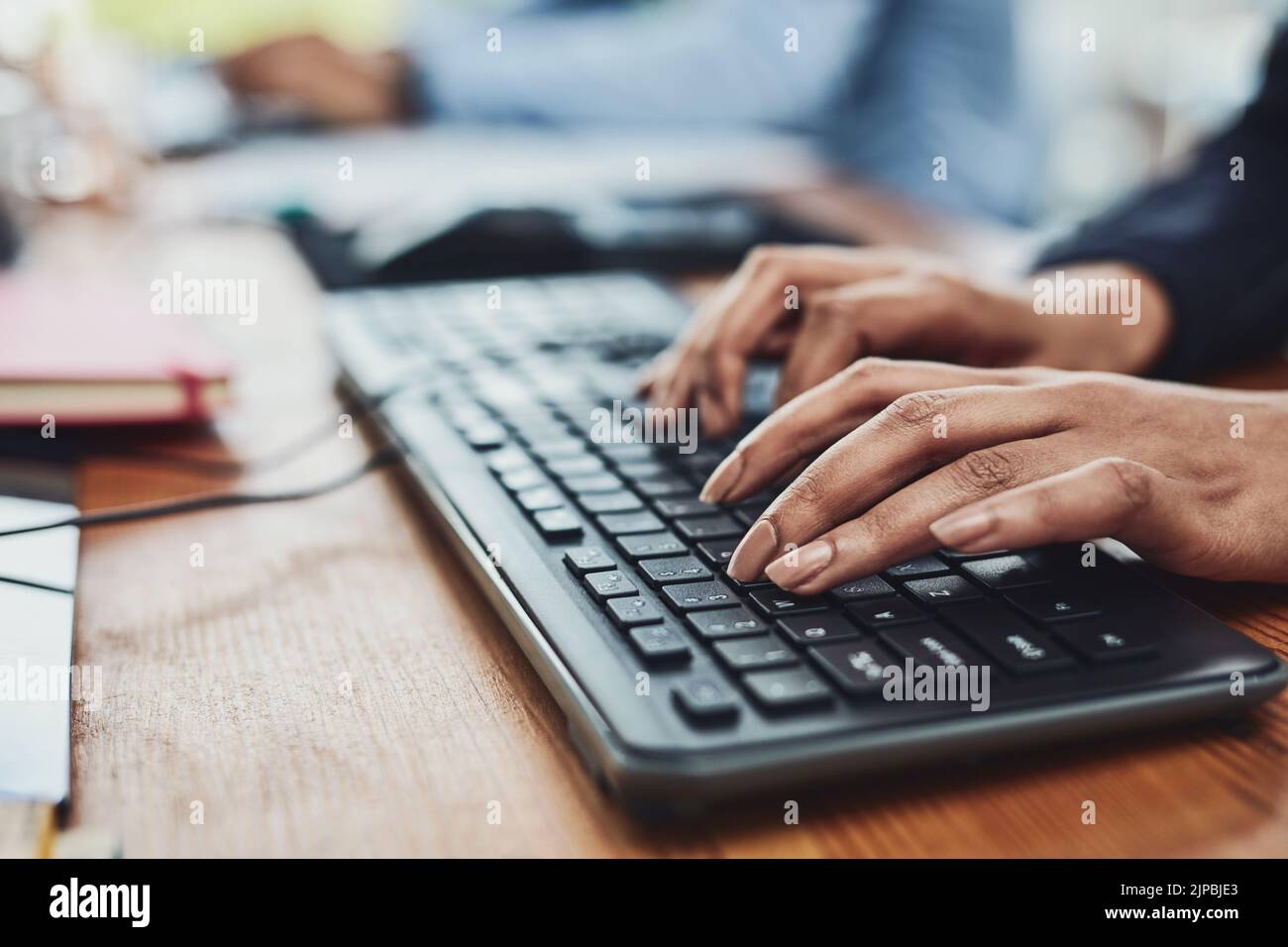 Starting the day by typing away. Closeup of two unrecognizable ...