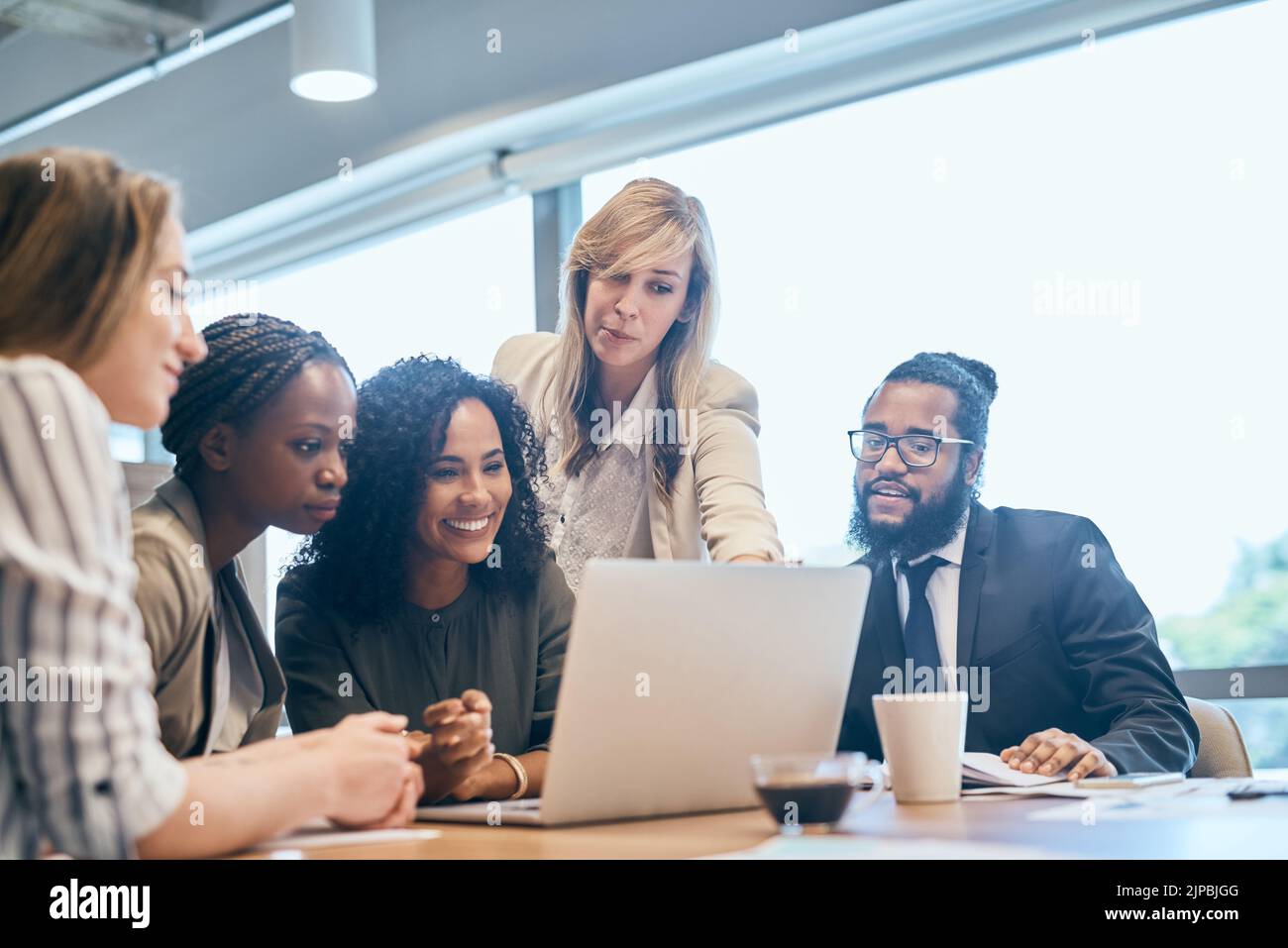 The team has got their full attention on the screen. a group of ...