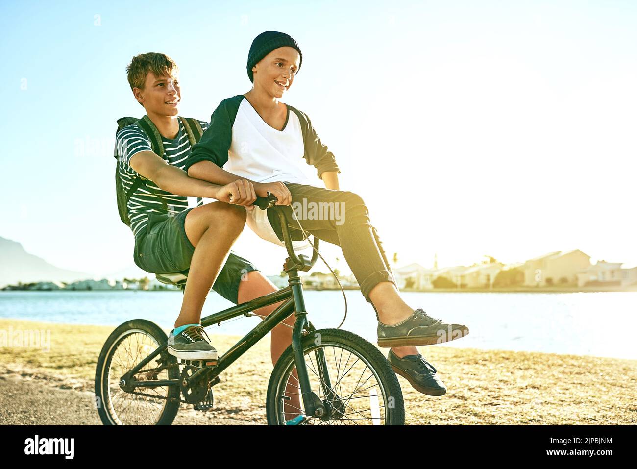 Your brother is your first friend. a young boy giving his younger ...