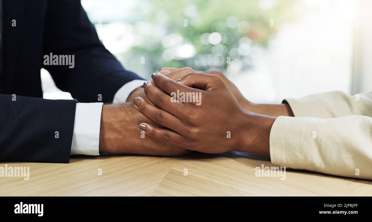 Be the kind of colleague who shows deep compassion. Closeup shot of two ...