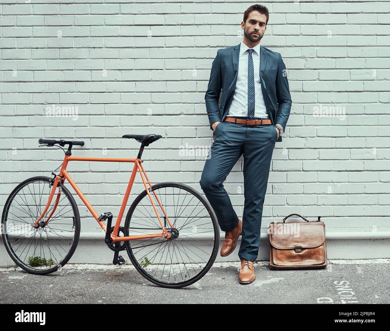 Young handsome businessman bike hi-res stock photography and images - Alamy