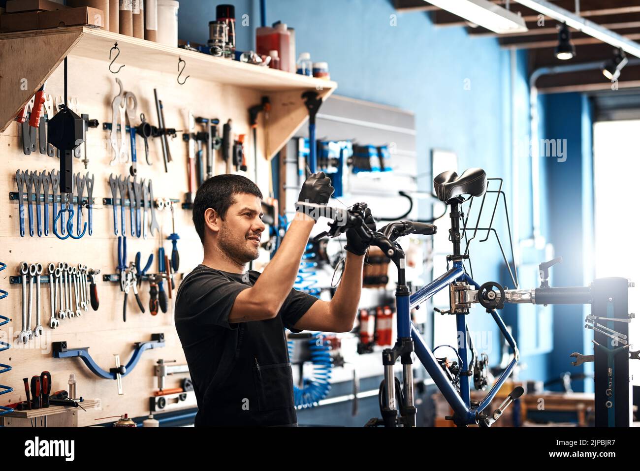 Hell repair your bike in no time at all. a man working in a bicycle ...