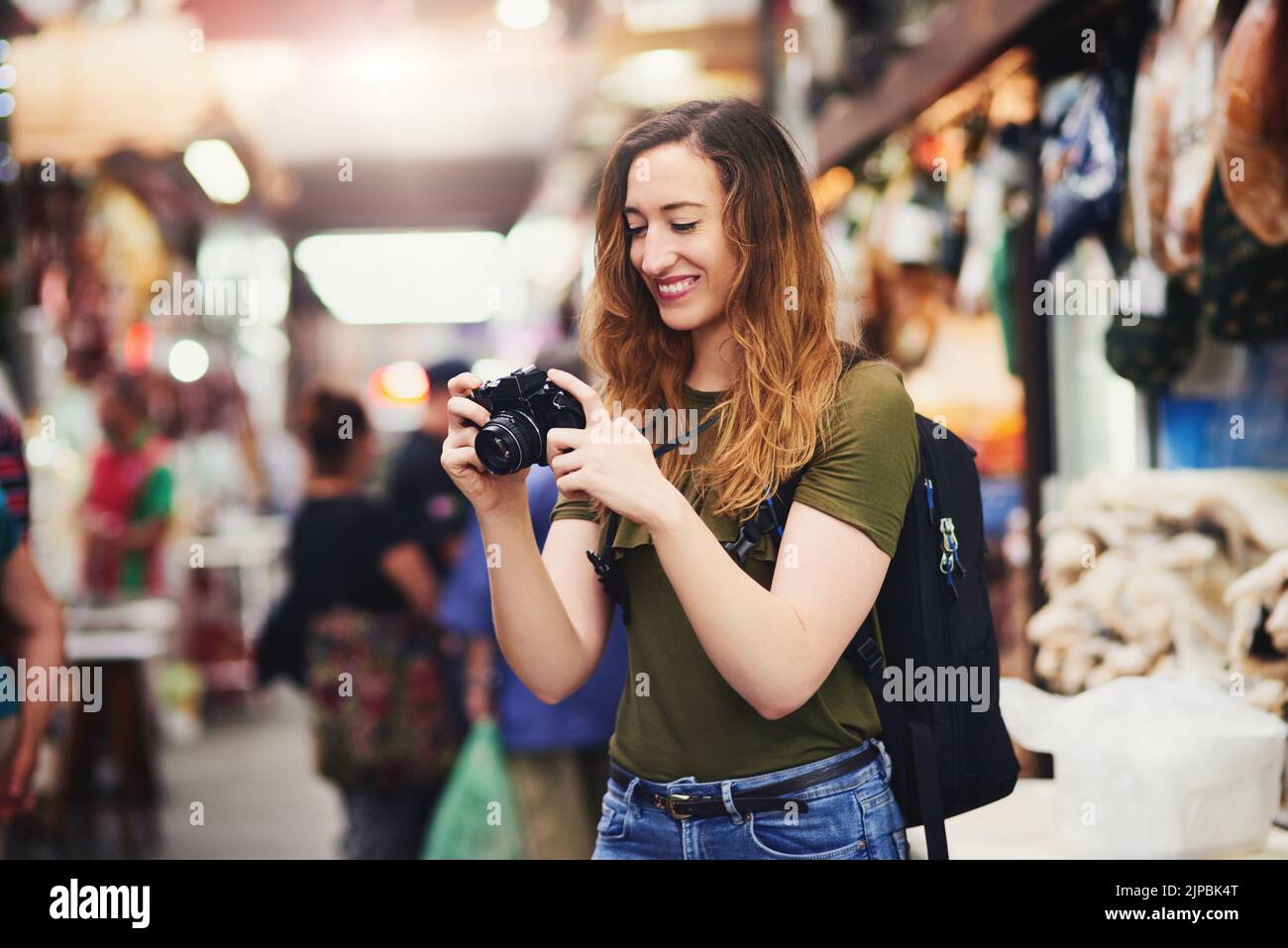 I have to make space for more photos. a cheerful young woman taking ...
