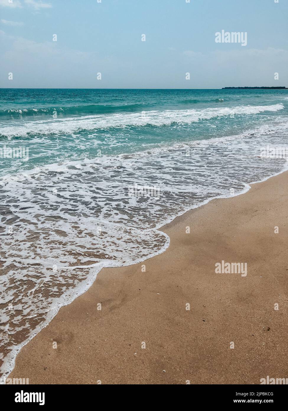 Sea blue aquamarine waves line sunny sand beach. Soft wave of ocean ...