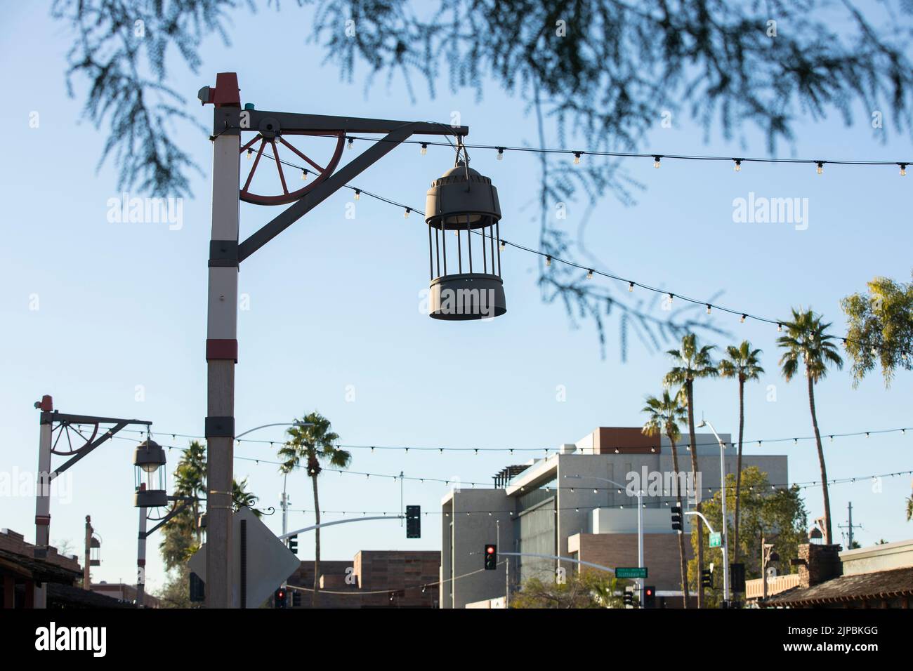 Late afternoon view of a light post framing the historic Old Town of ...