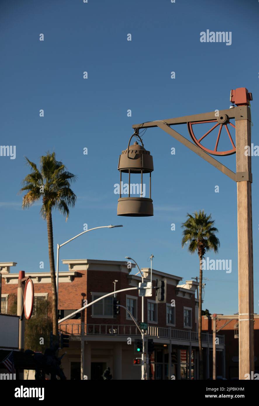 Late afternoon view of a light post framing the historic Old Town of ...