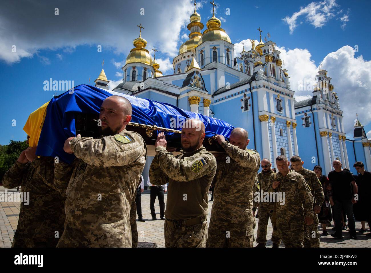 Ukrainian soldiers carry the coffin covered with a national flag during ...