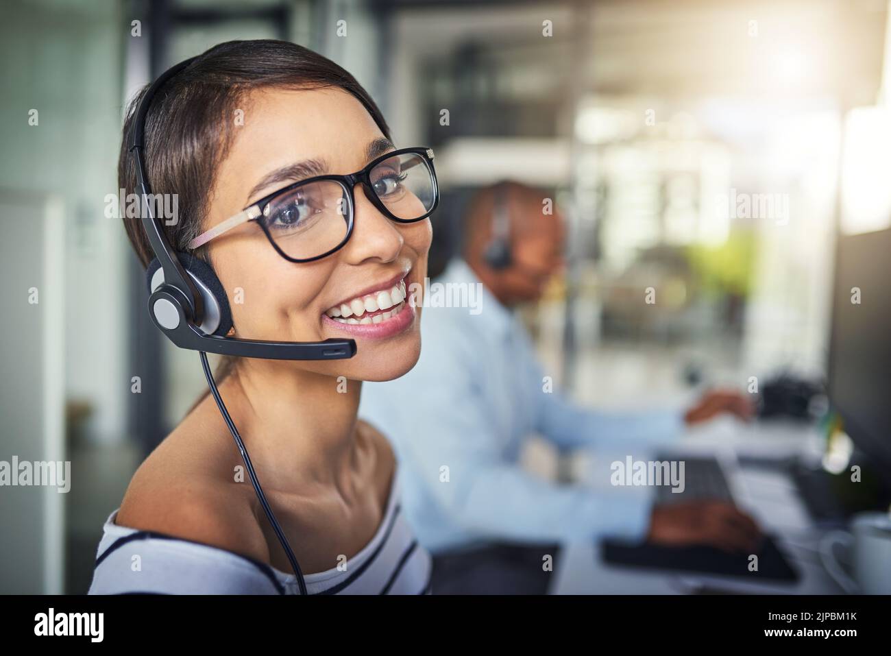 The most friendly customer service agent in the office. a young ...