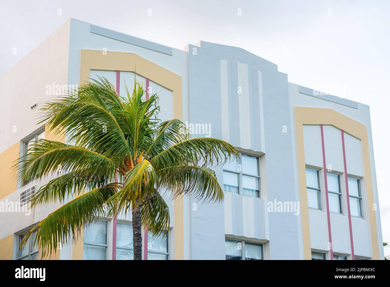 Closeup of typical colorful Art Deco architecture with tropical palm ...