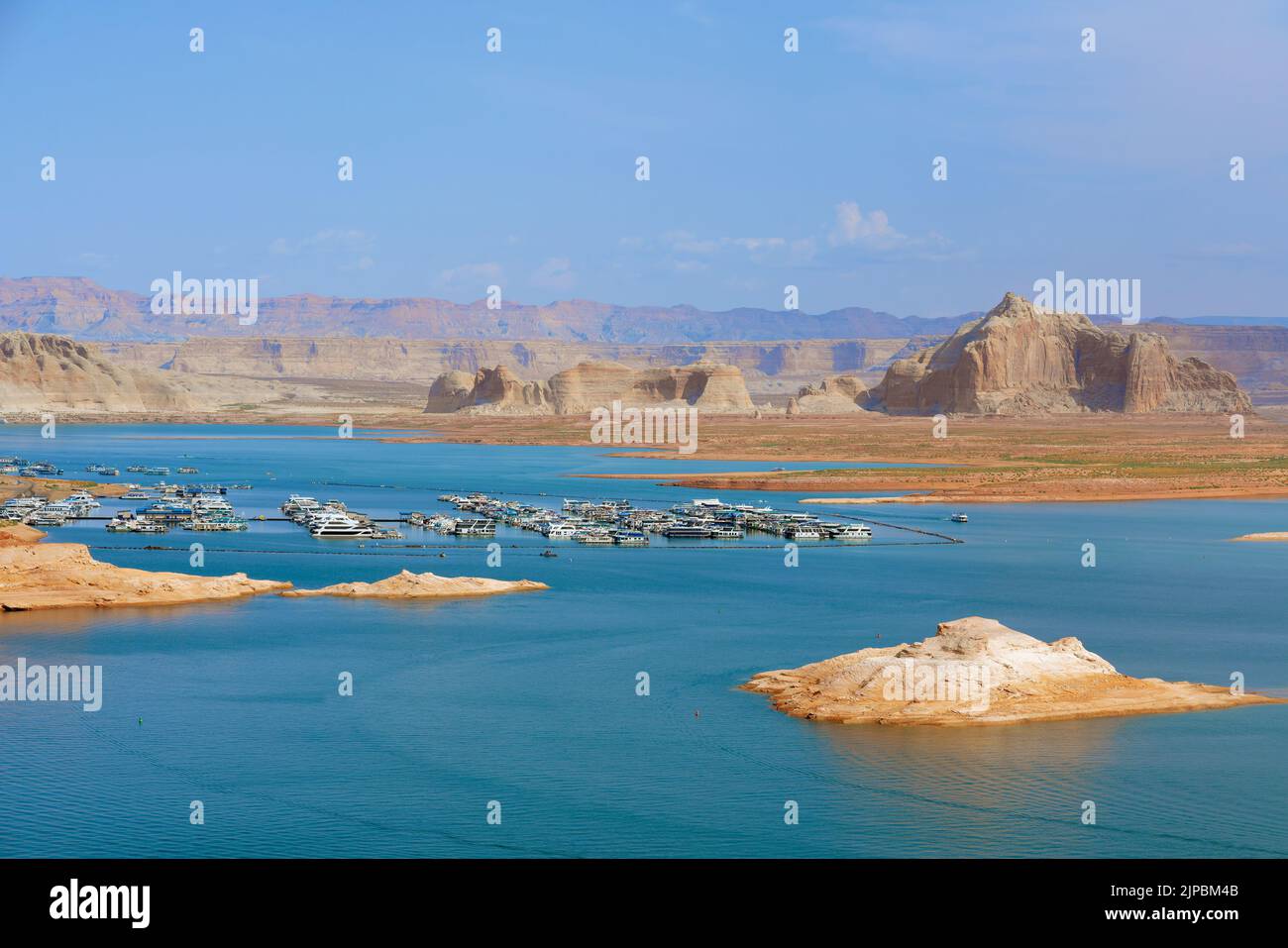 Lake Powell overlook. Morred boats, blue water, and red rocks, Southern ...