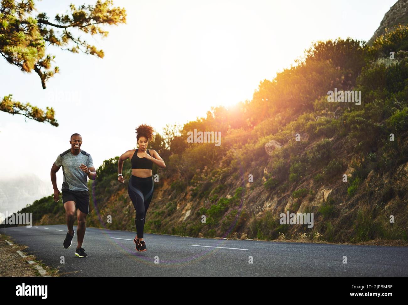Staying healthy is a priority. a young couple out running together ...