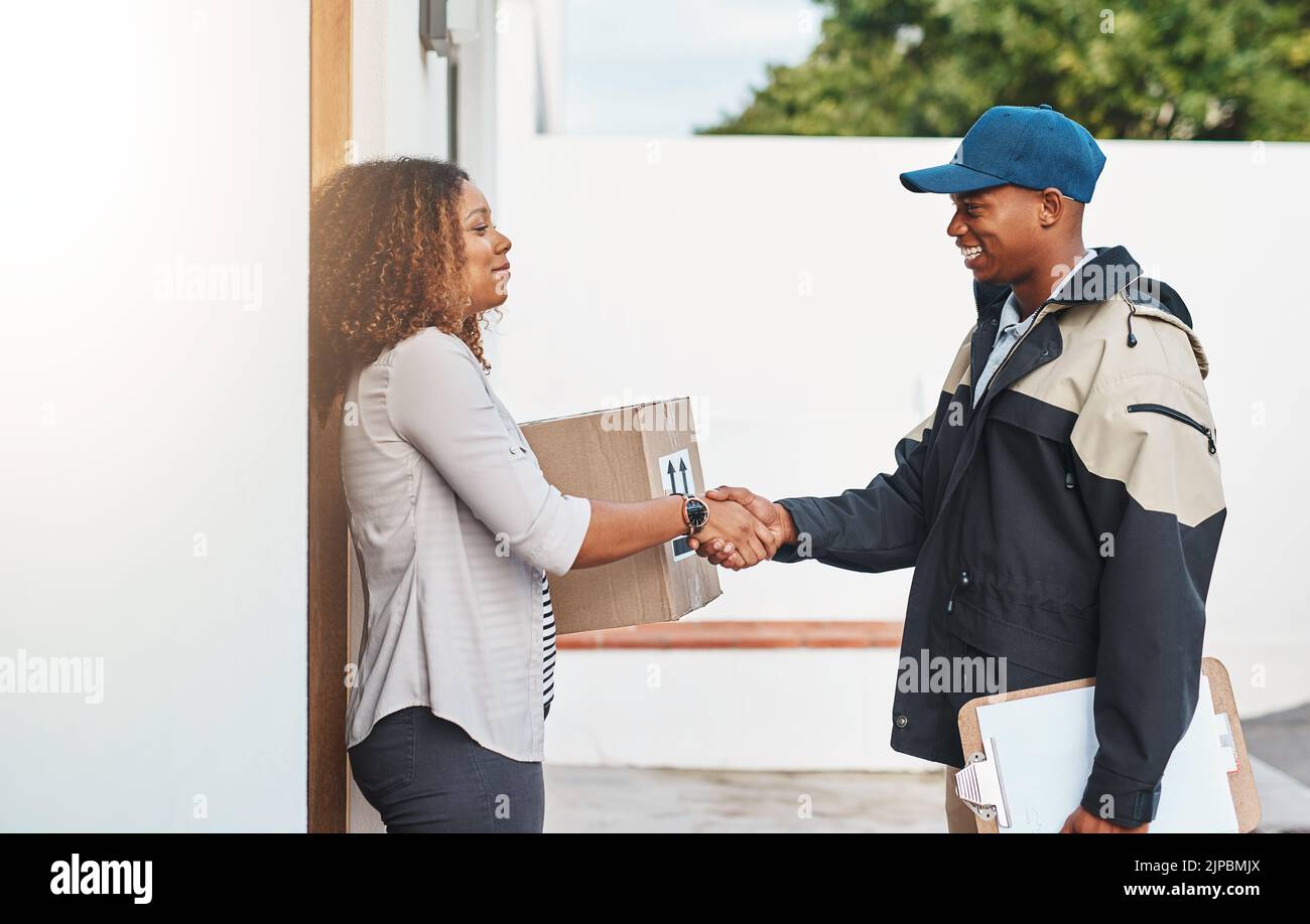 Your service never disappoints. a courier shaking hands with a customer ...