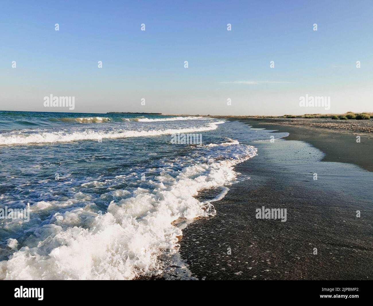 Sea blue aquamarine waves line sunny sand beach. Soft wave of ocean ...