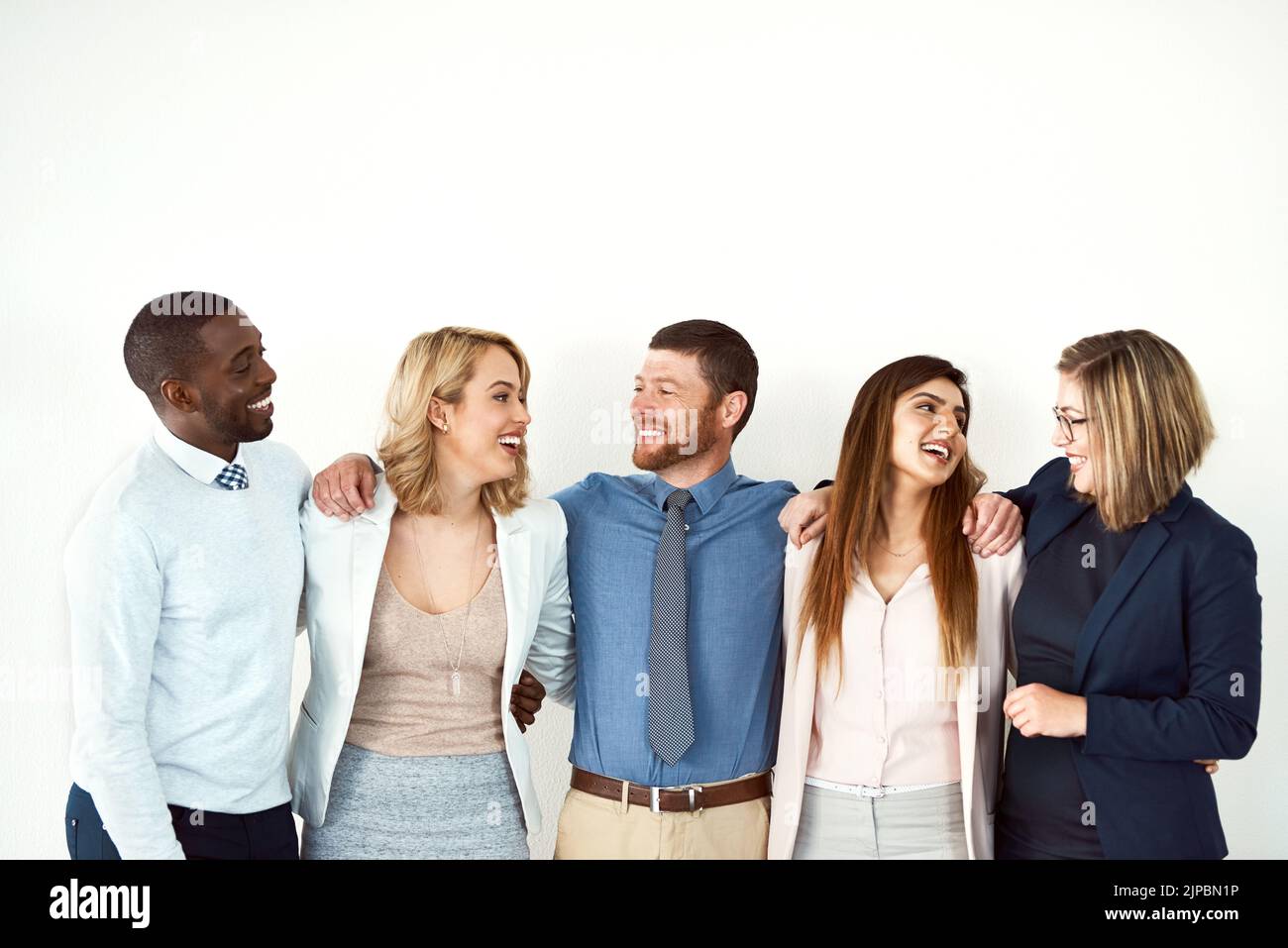 These bunch are real close. Studio shot of a group of work colleagues ...