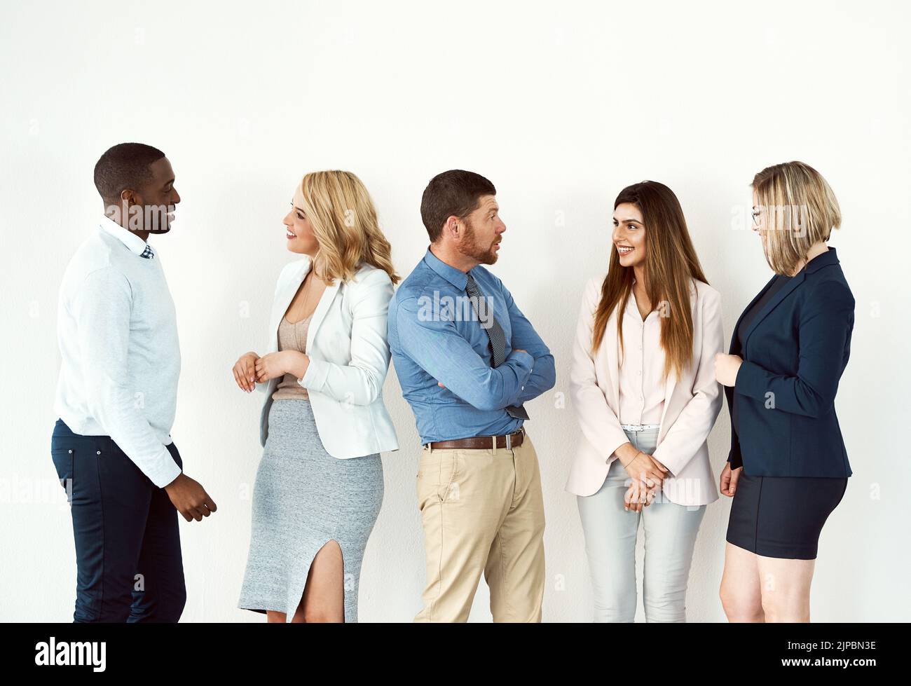 Some banter for the day. Studio shot of a group of confident work ...