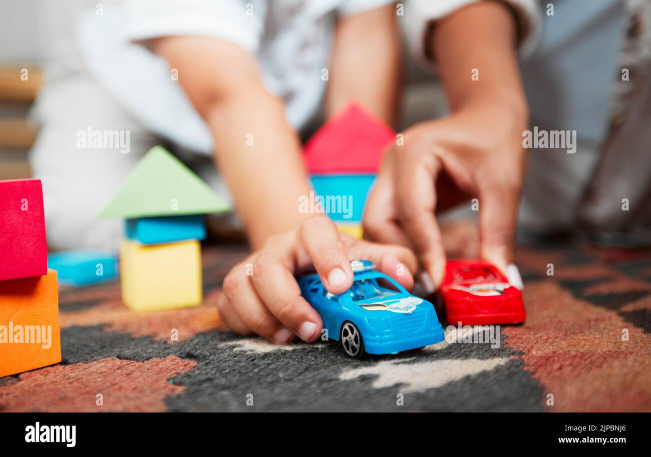 Child playing with small cars hi-res stock photography and images - Alamy