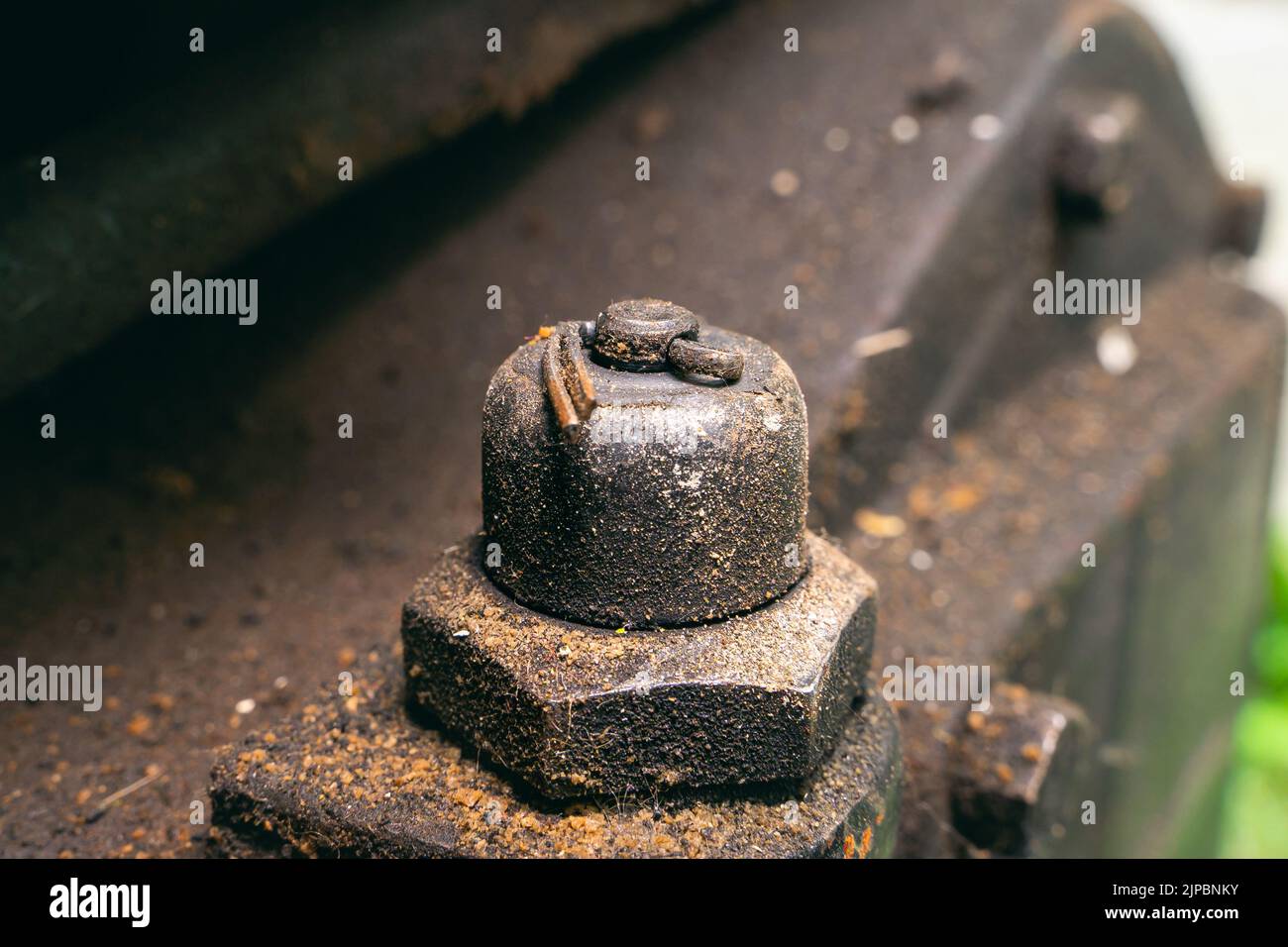 Old oil pressure sensor on a walk-behind tractor close-up on the engine ...