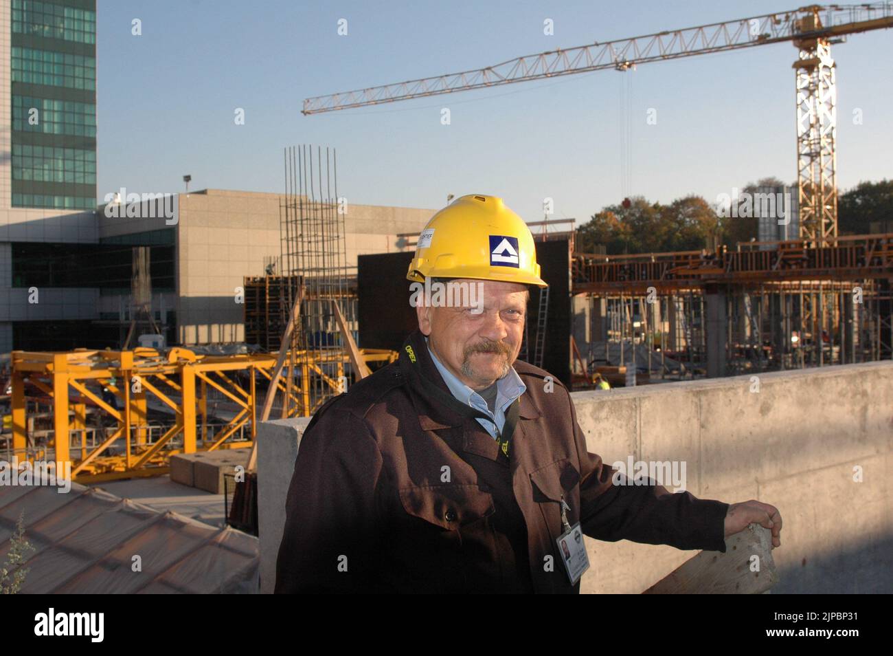 Polish construction worker male and construction work site inPoznan ...