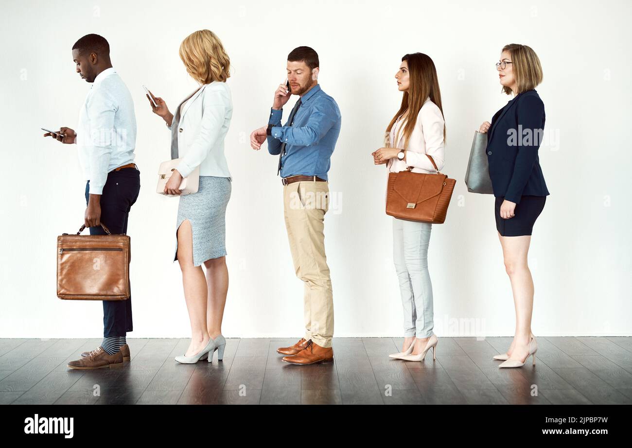 Ready to get on the move. Studio shot of a group o focused people ...