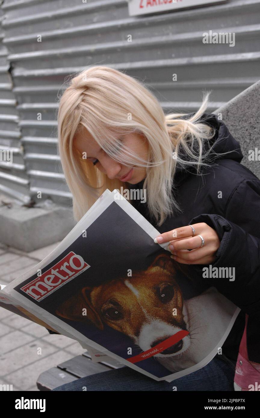polish man distributing free Poznan Free Metro paper in Poznan Poaldn ...