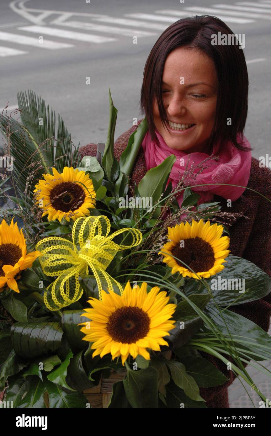 Polish woman with sunflowers buoquit in Poznan Poaldn Oct. 21,2005 ...