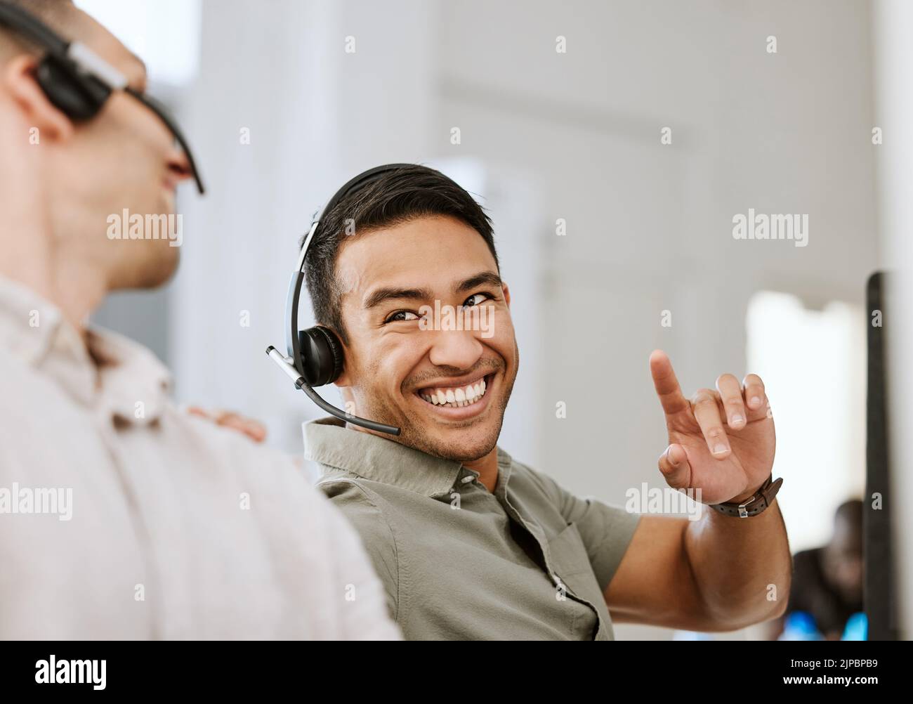 Happy, smiling and laughing call center agent at an insurance company ...