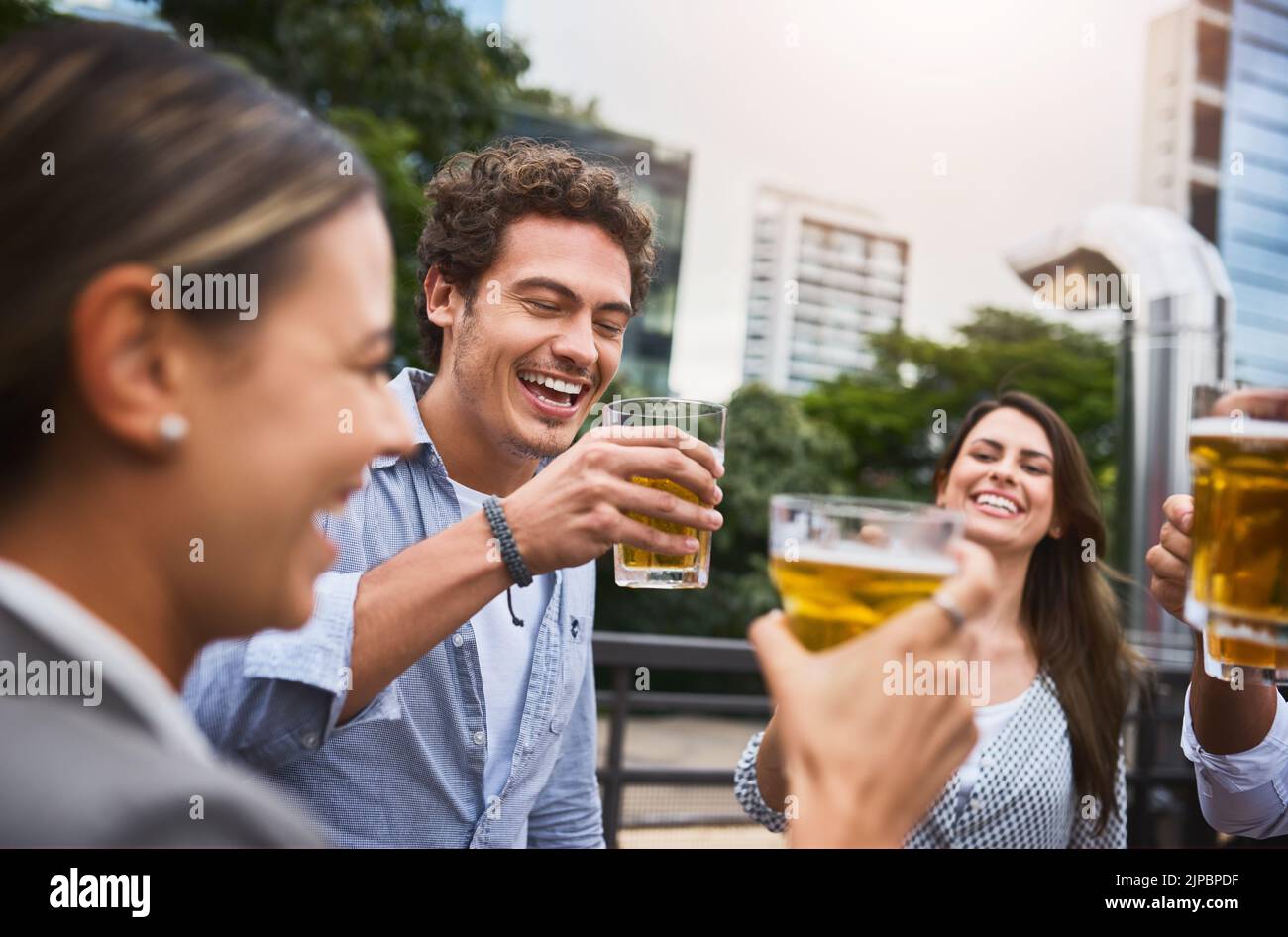 Celebrating yet another successful week. businesspeople having drinks ...