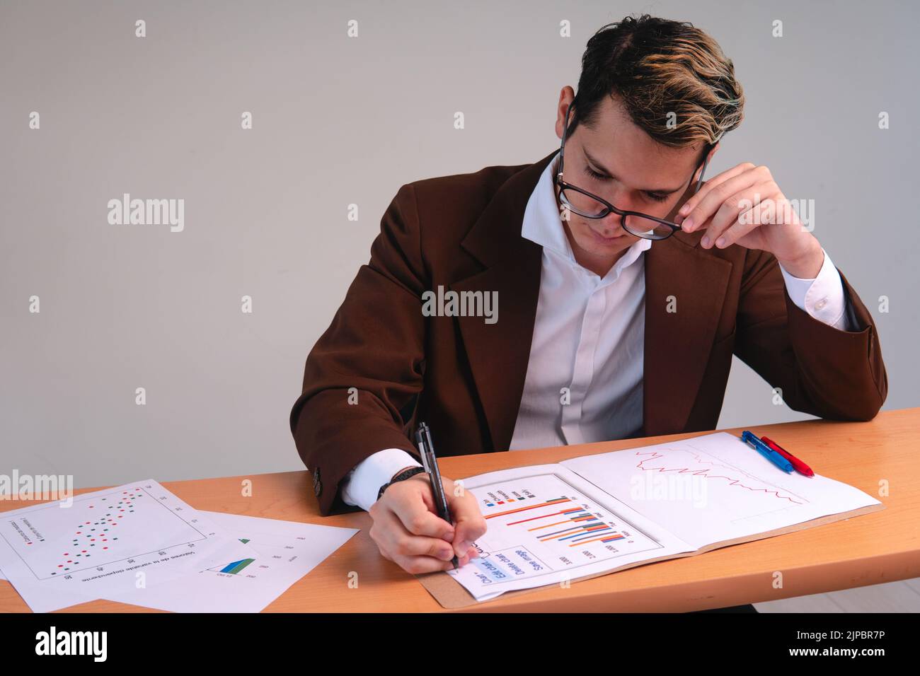 Business man reviewing important charts. Business executive working at ...