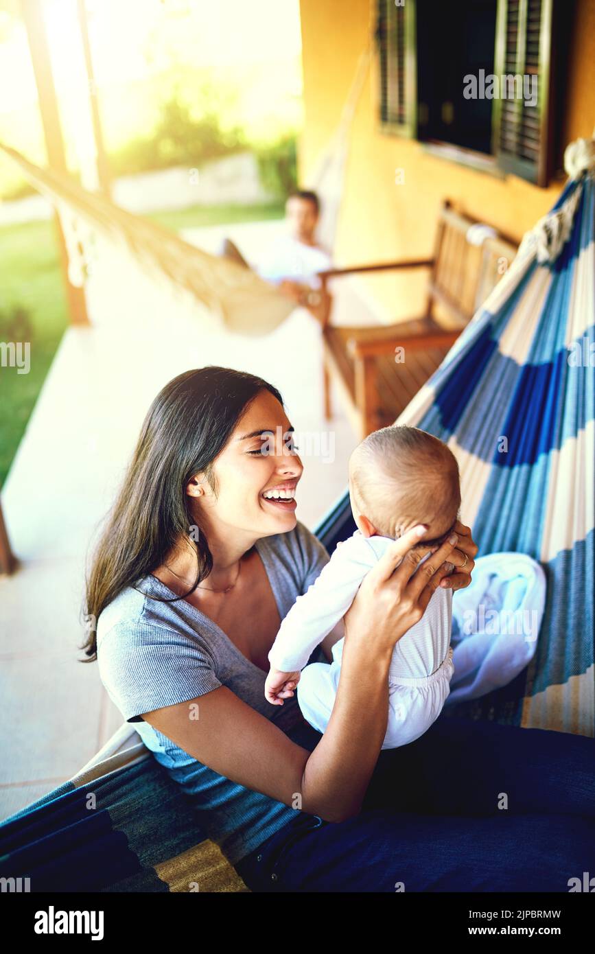 Youre growing up so quickly. a cheerful young mother holding her baby ...
