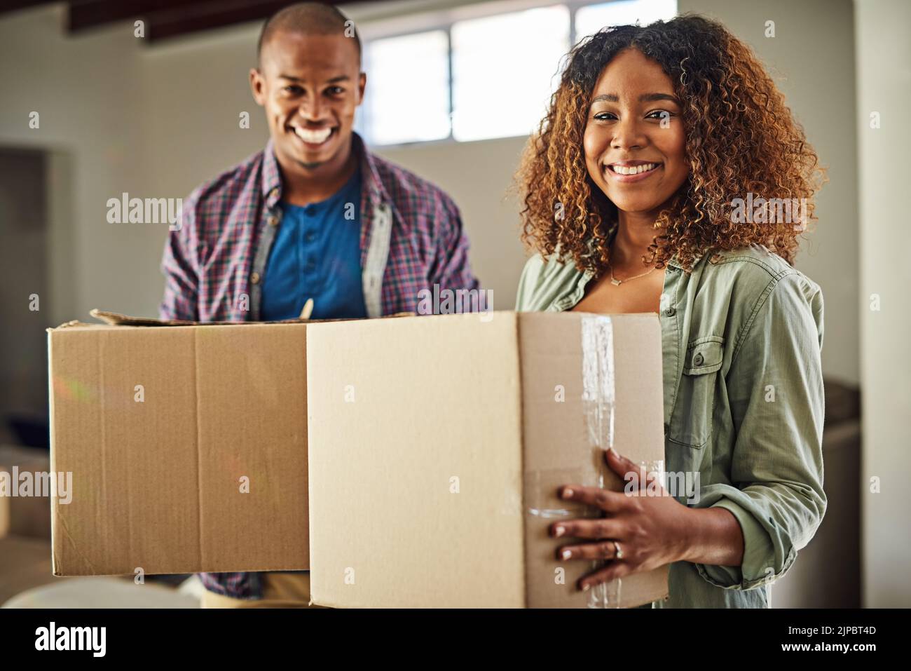 Our life is beginning one step at a time. Portrait of a cheerful young ...
