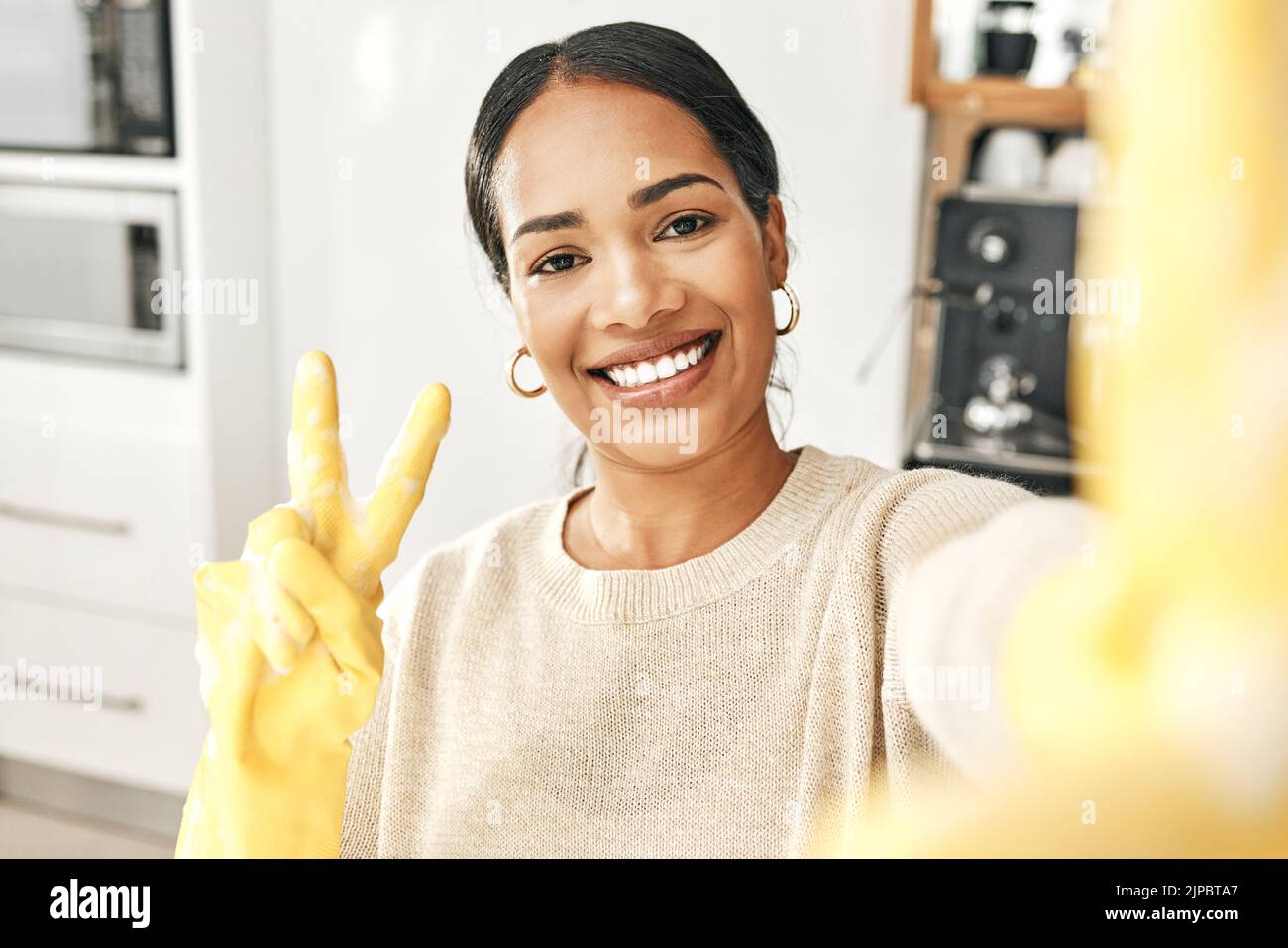 Peace sign, clean and hygienic domestic taking a selfie with a hand ...