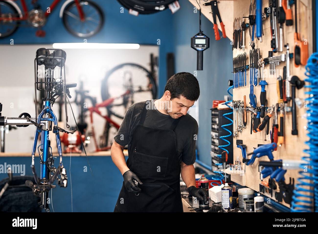 Giving second hand bikes a second chance. a man working in a bicycle ...