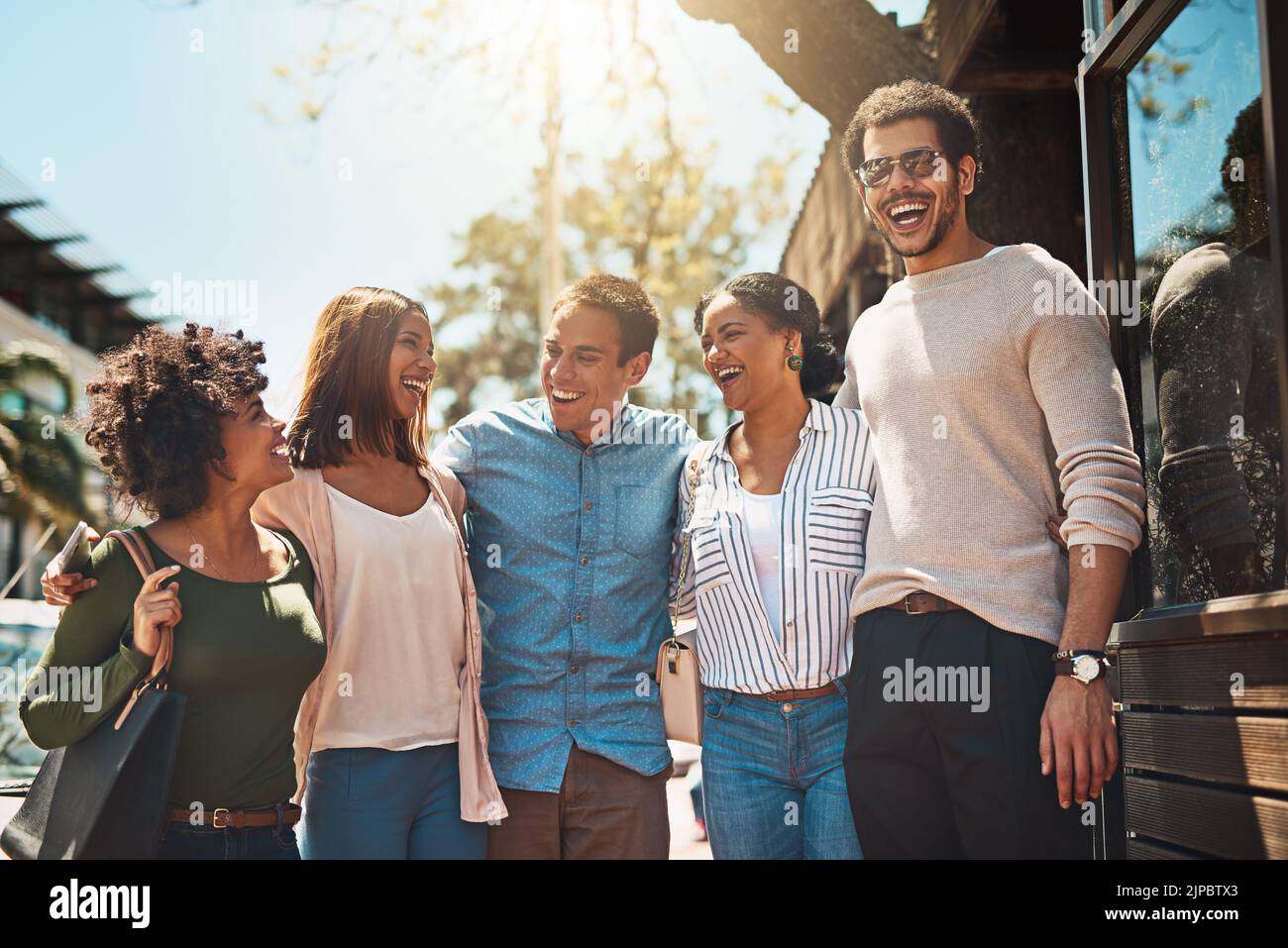 Time to go find a coffee shop. a cheerful young group of friends ...