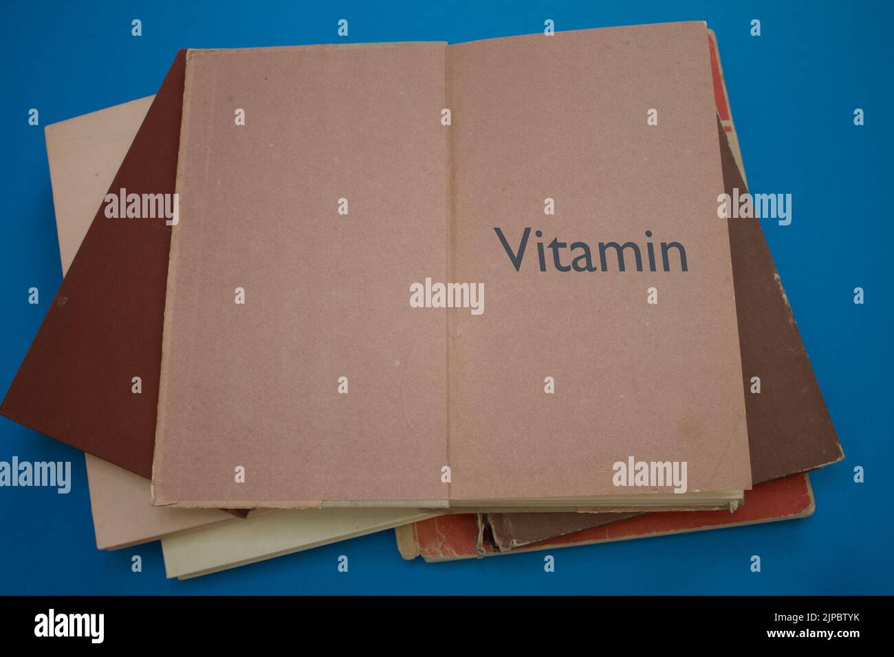 Vitamin word in opened book with vintage, natural patterns old antique ...