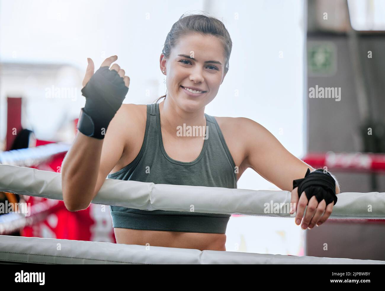Active, fit and young female boxer ready for a boxing exercise, workout ...