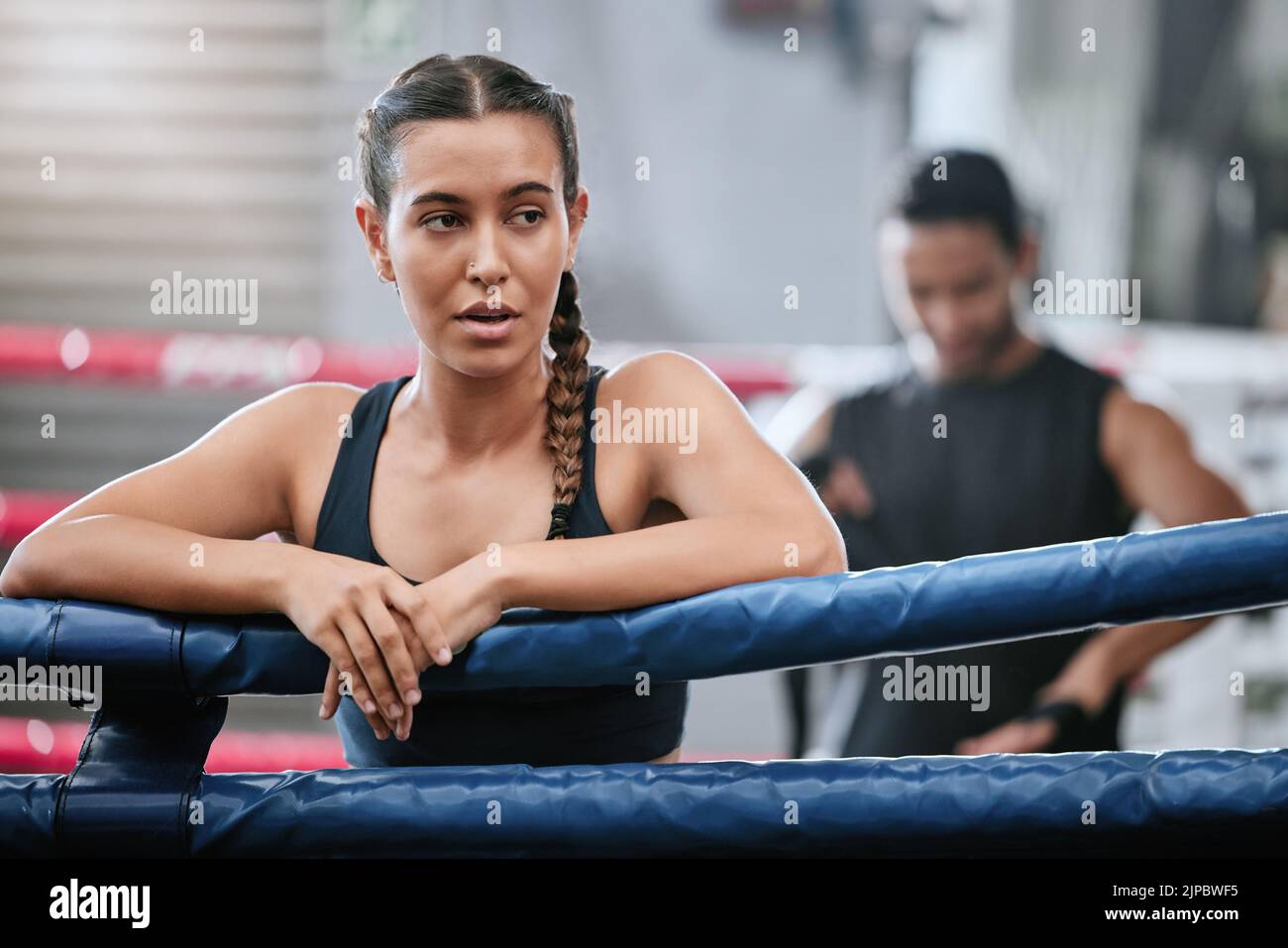 Fit, active and tired boxer taking break, resting and breathing after ...