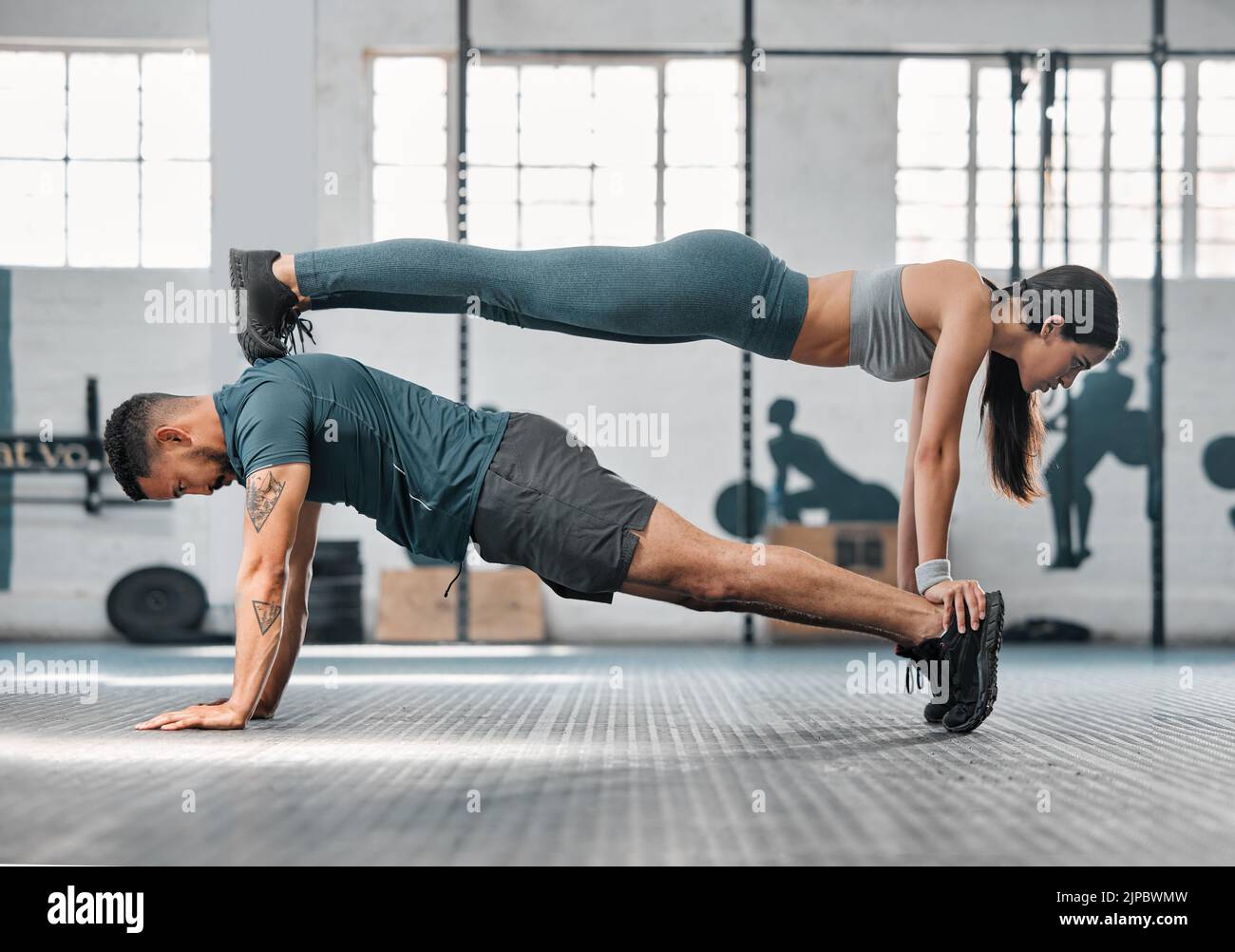 Strength, active and fit couple exercising, training or doing workout ...