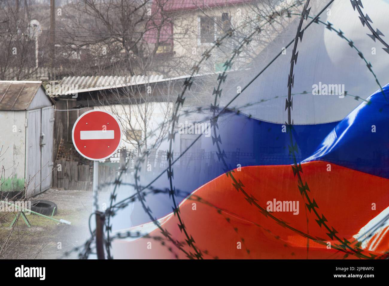 Road sign traffic is prohibited on the background of private houses and ...