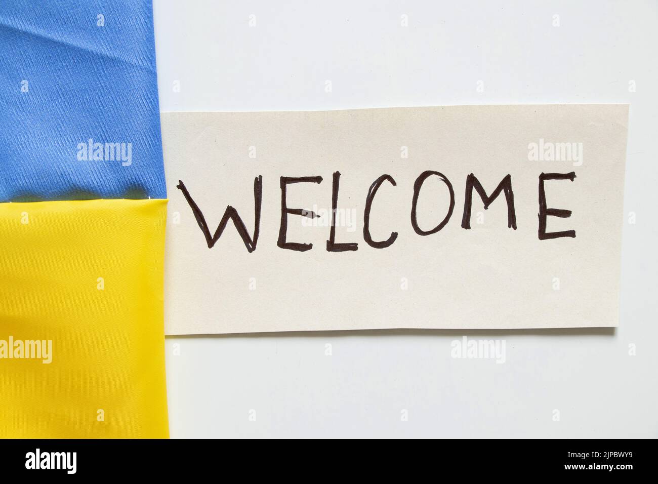 Text welcome and the national flag of Ukraine is yellow-blue on a white ...