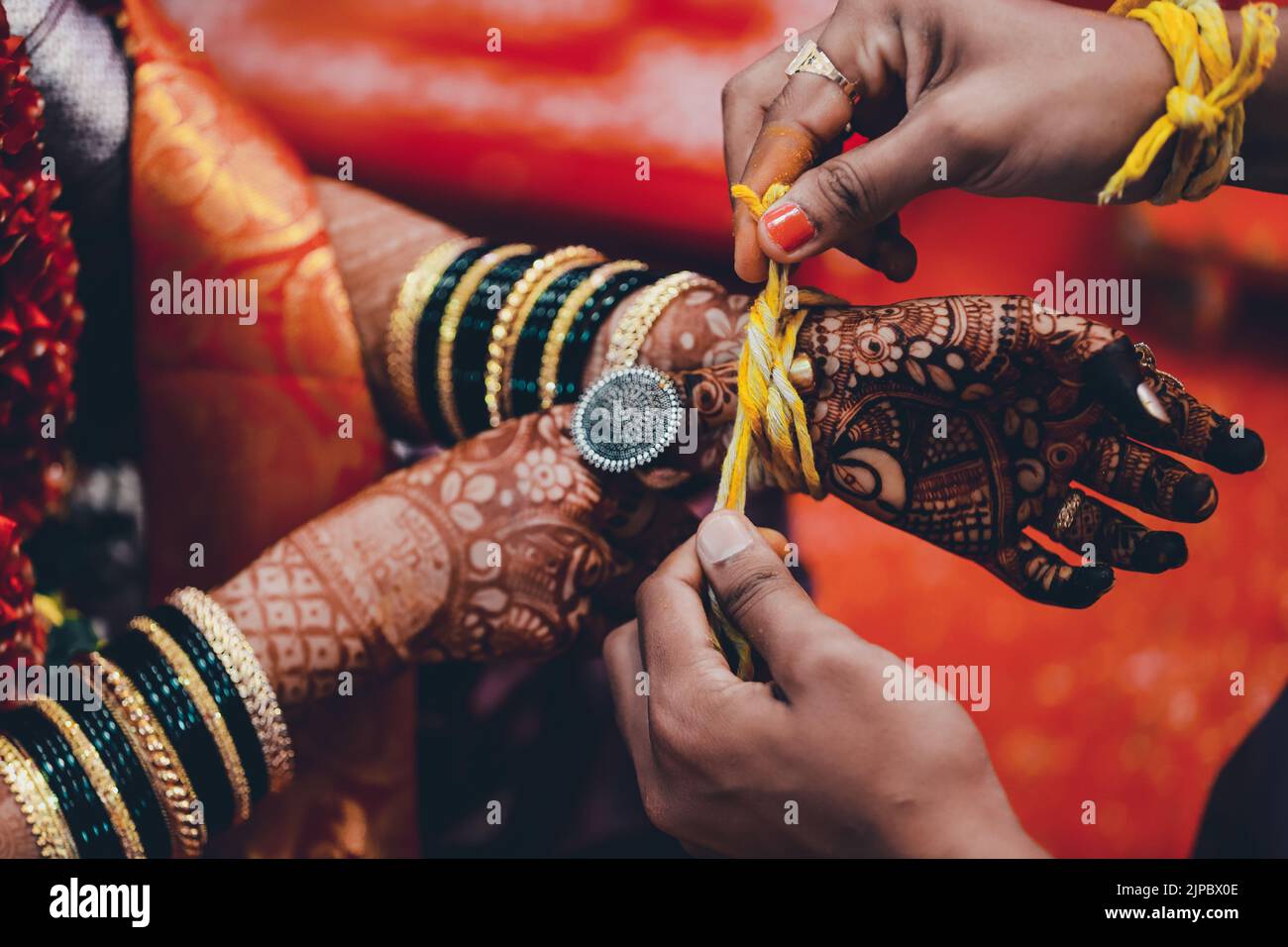 A closeup of a Kanyadan ritual moment giving a blessing to bride and ...