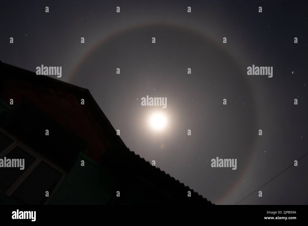 Halo phenomenon on the moon over Ukraine at night during the war in the ...