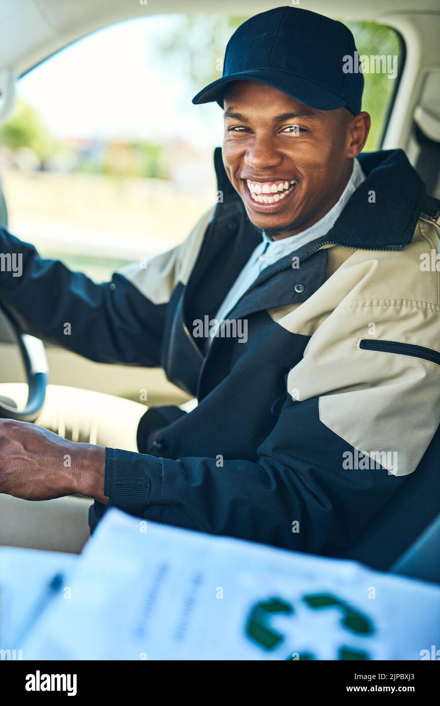 Off to do some rounds. Portrait of a courier driving a delivery van ...