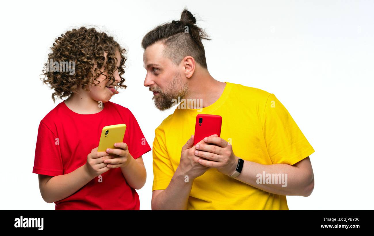Concerned dad checks daughter Internet activity. Man in basic t-shirt ...