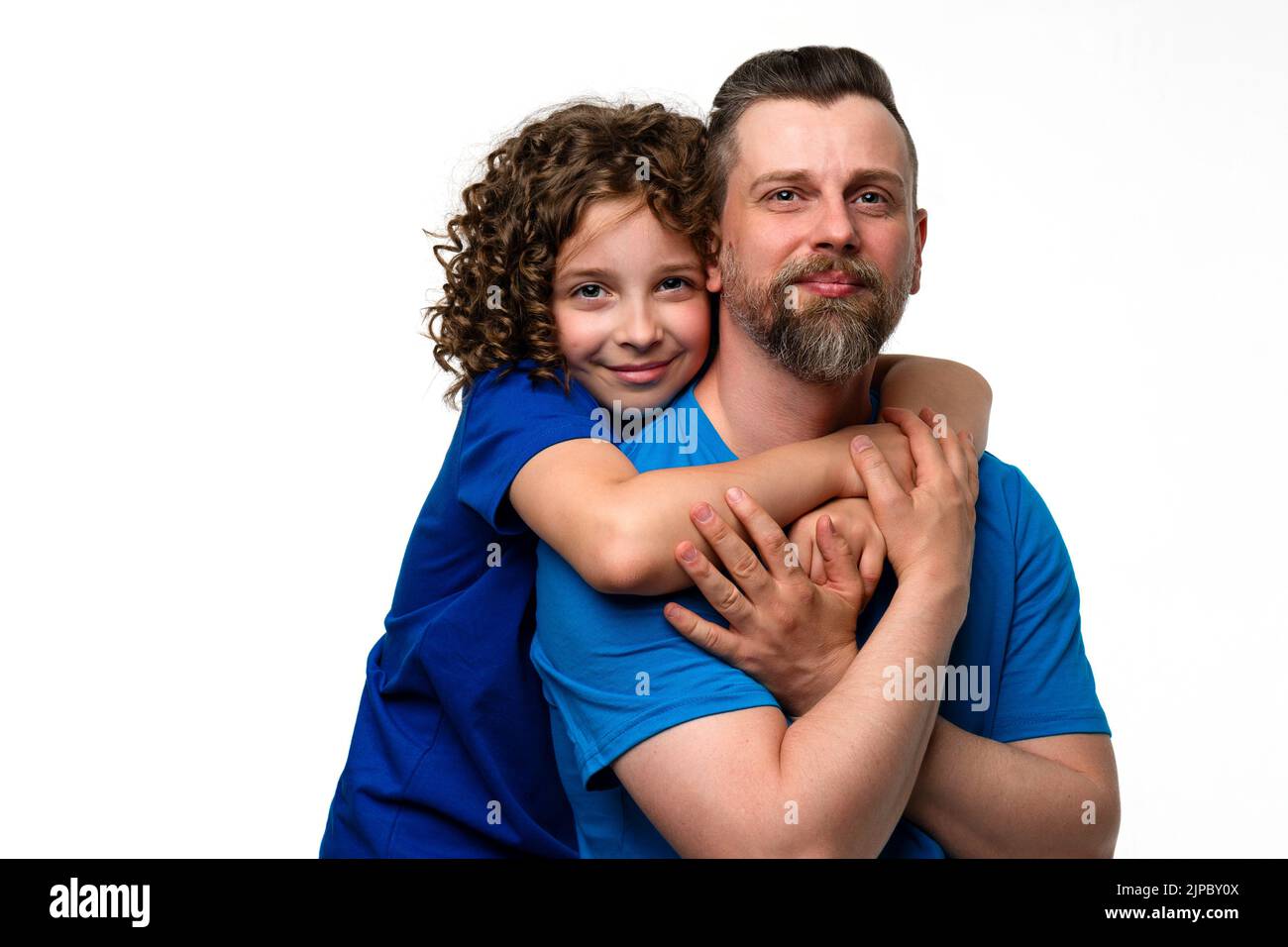 Handsome dad holding piggyback adorable 10-12s daughter. Female child ...