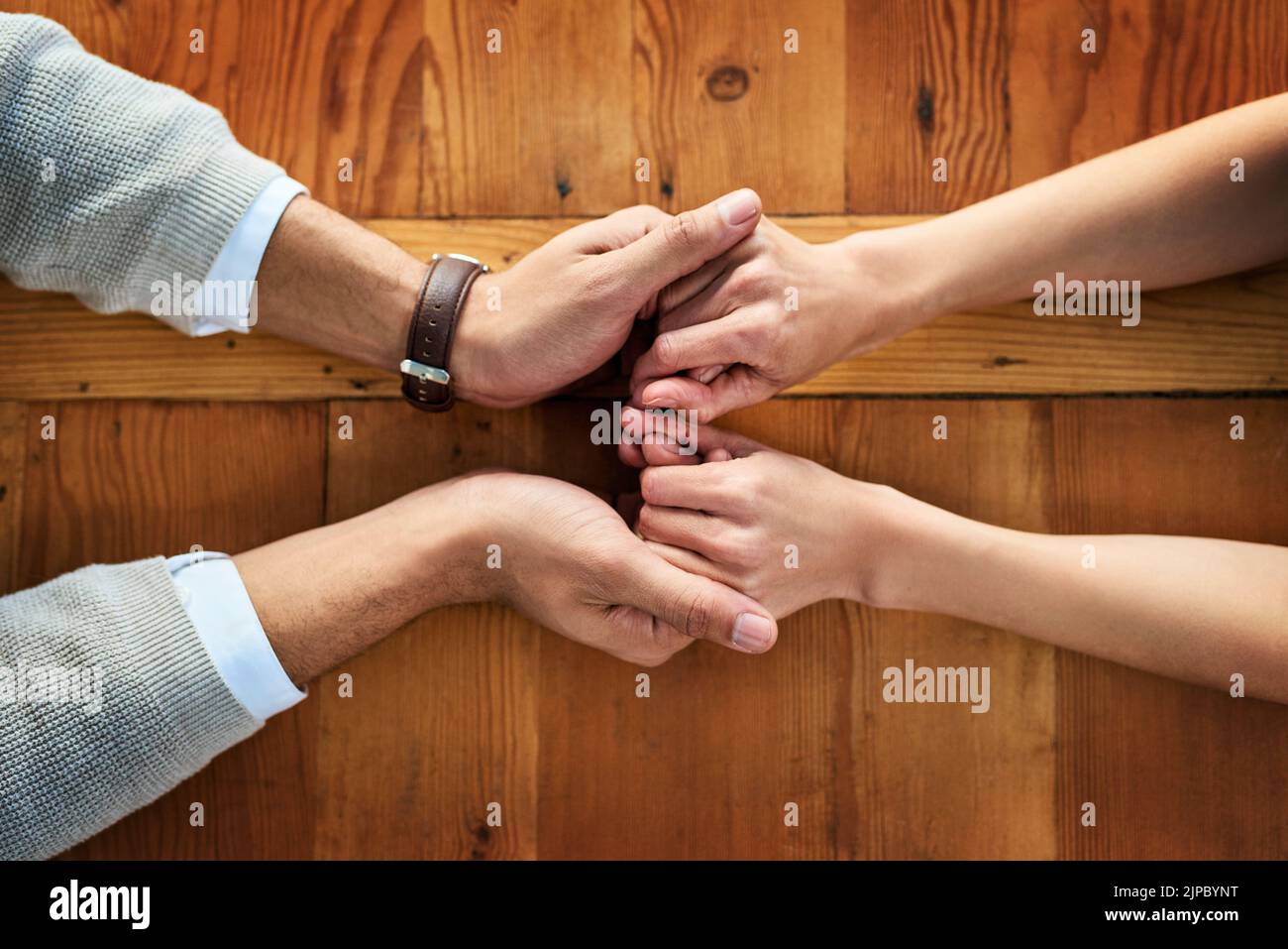 We are stuck together like glue. two unrecognizable people holding ...