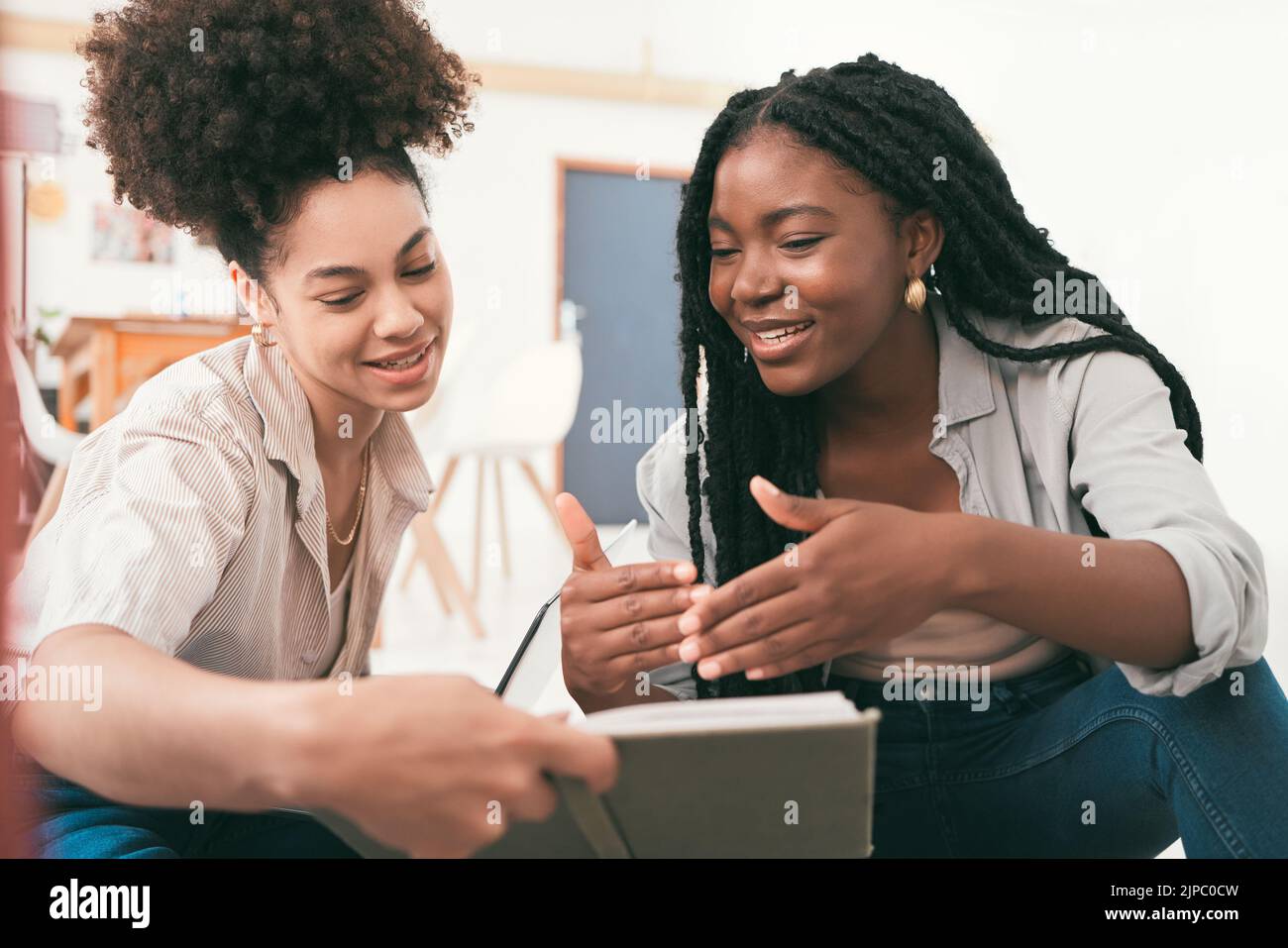 Talking, planning and collaboration of female university students working on a group project ...